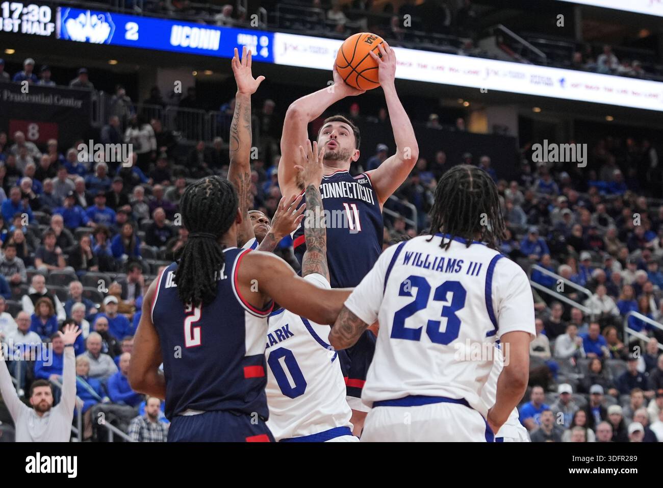 UConn's Alex Karaban (11) shoots over Seton Hall's Adam Clark (0 ...