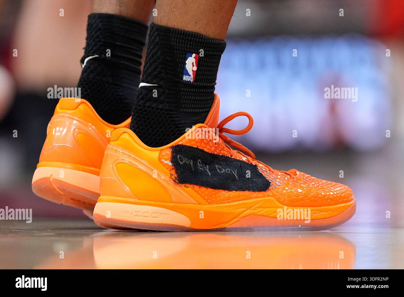 Chicago Bulls forward Isaac Okoro wears a taped message on his shoes ...