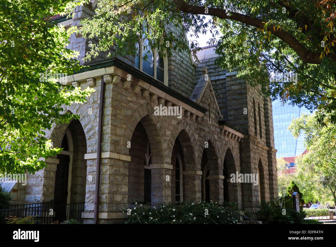 Historic stone church building with arched windows and gothic ...