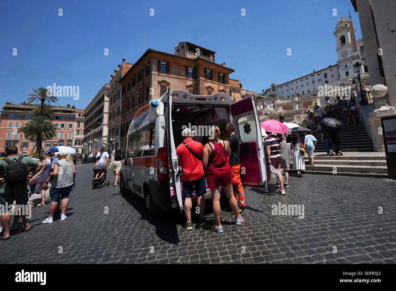 FILE - Paramedics provide aid to tourists and residents with an ...