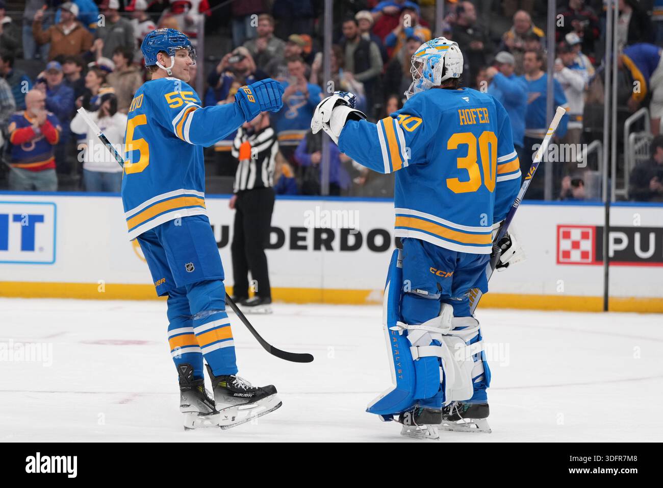 St. Louis Blues goaltender Joel Hofer (30) and teammate Colton Parayko ...
