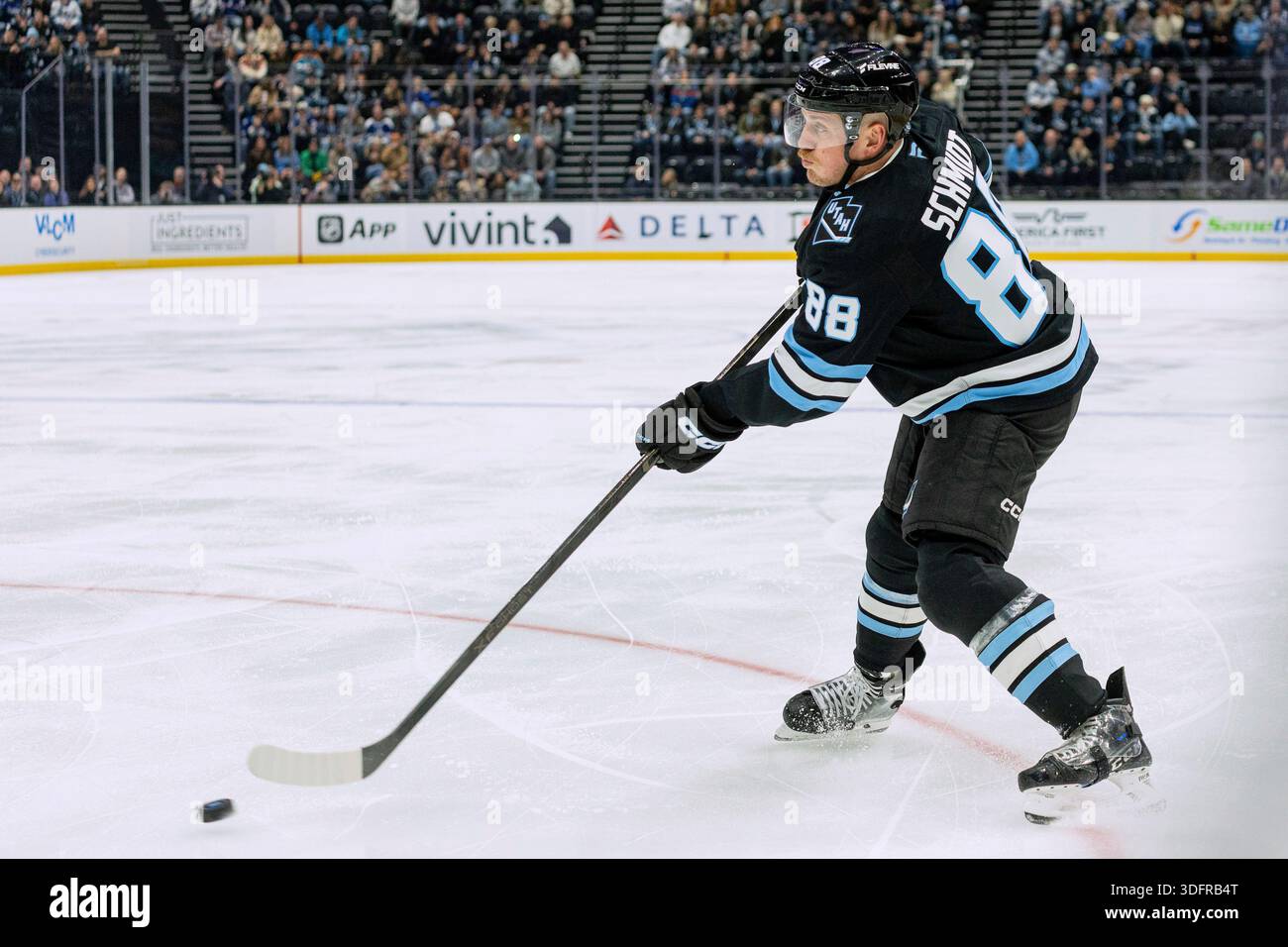 Utah Mammoth defenseman Nate Schmidt (88) moves the puck against the ...