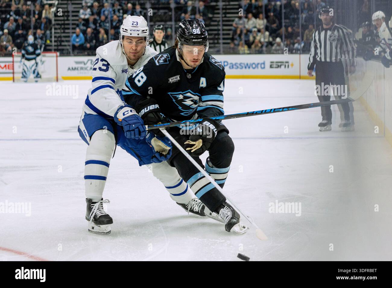 Utah Mammoth defenseman Mikhail Sergachev (98) fights for the puck ...