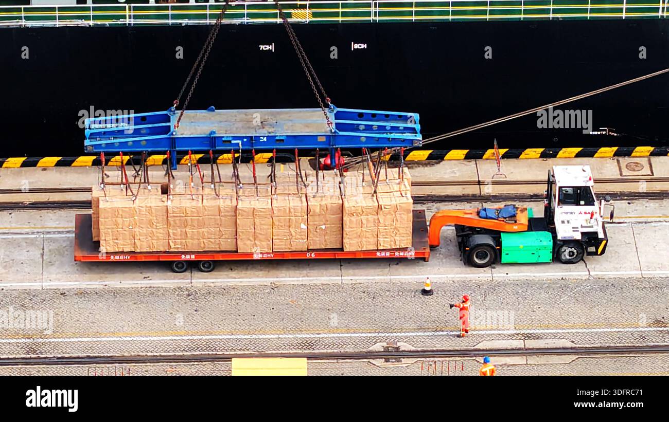 QINGDAO, CHINA - JANUARY 14, 2026 - A cargo ship unloads imported pulp ...
