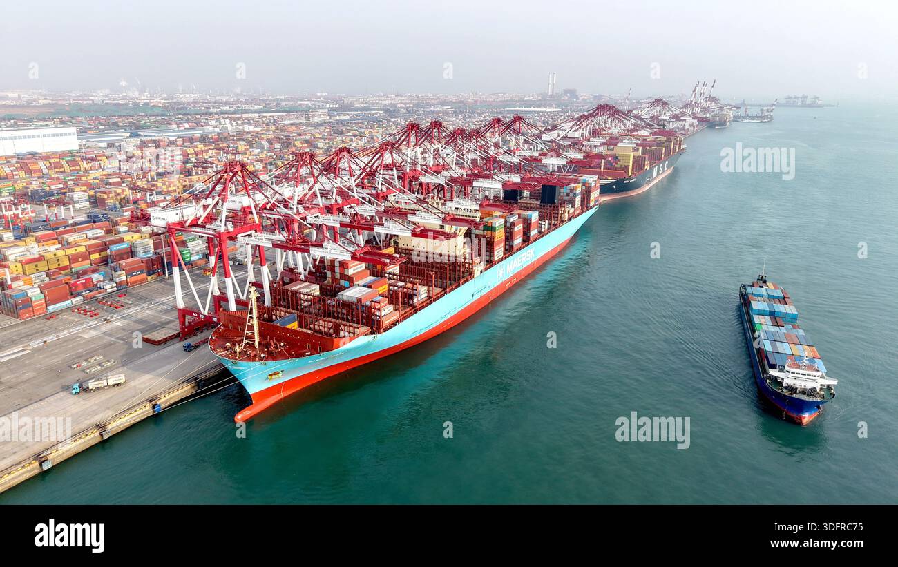 QINGDAO, CHINA - JANUARY 14, 2026 - The cargo ship is loading and ...