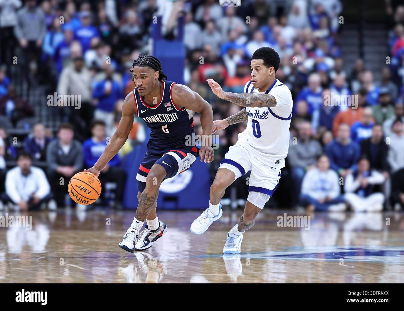 UConn Huskies guard Silas Demary Jr. (2) dribbles up court while Seton ...
