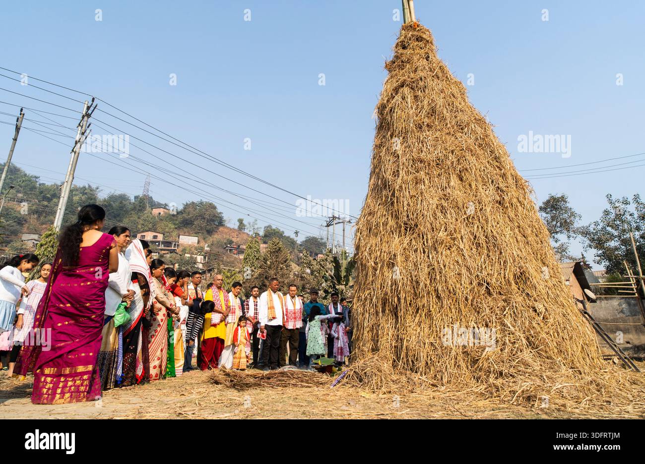 Assamese people gather to light a traditional 'Meji' bonfire while ...
