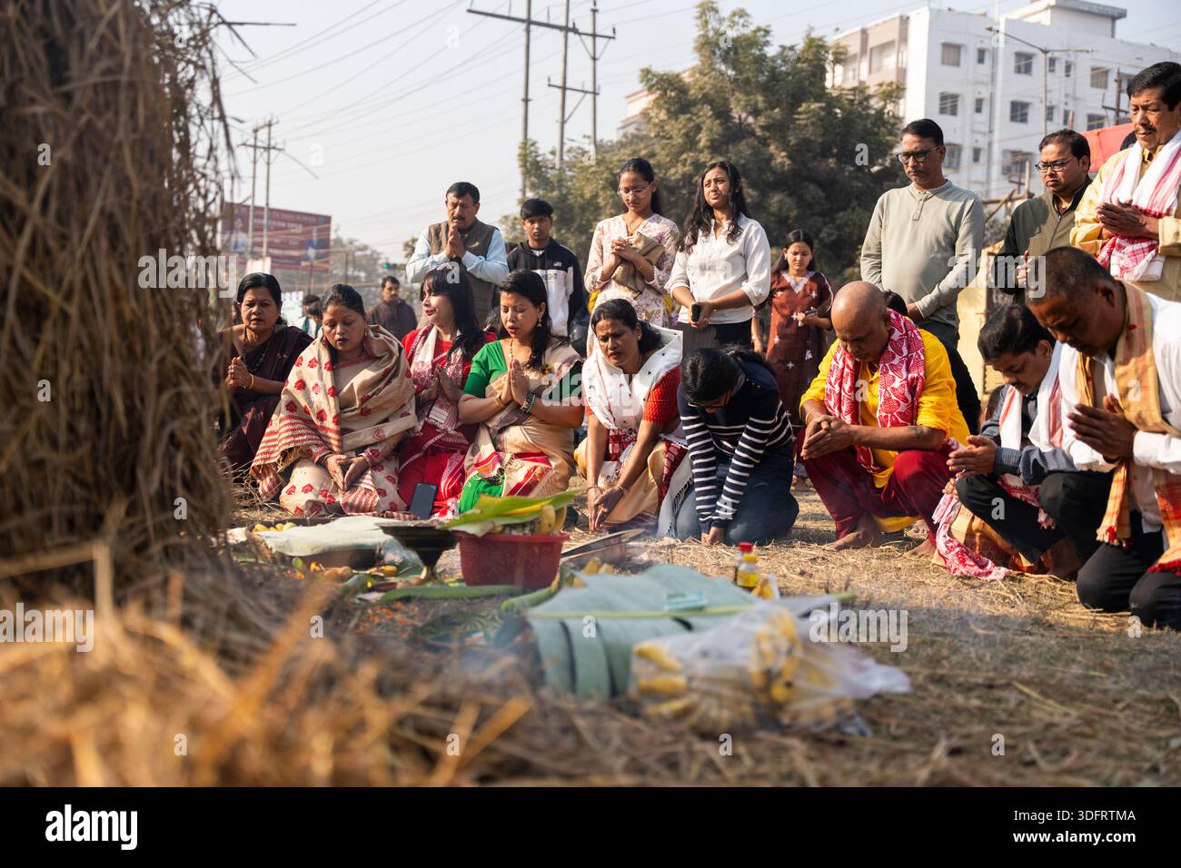 Assamese people offer prayers before light a traditional 'Meji' bonfire ...