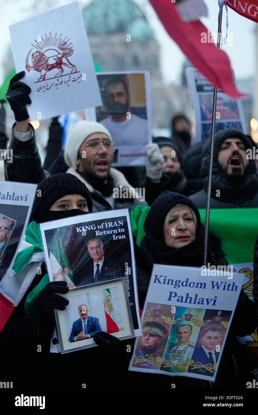 FILE - Protesters hold pictures of Reza Pahlavi, Crown Prince of Iran ...