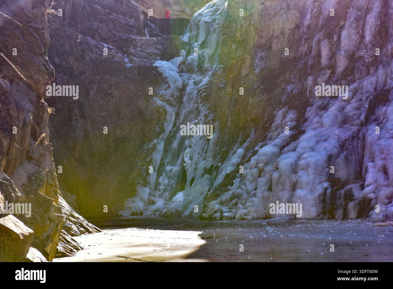Tourists admire the spectacular ice waterfall scenery of Longtan Grand ...