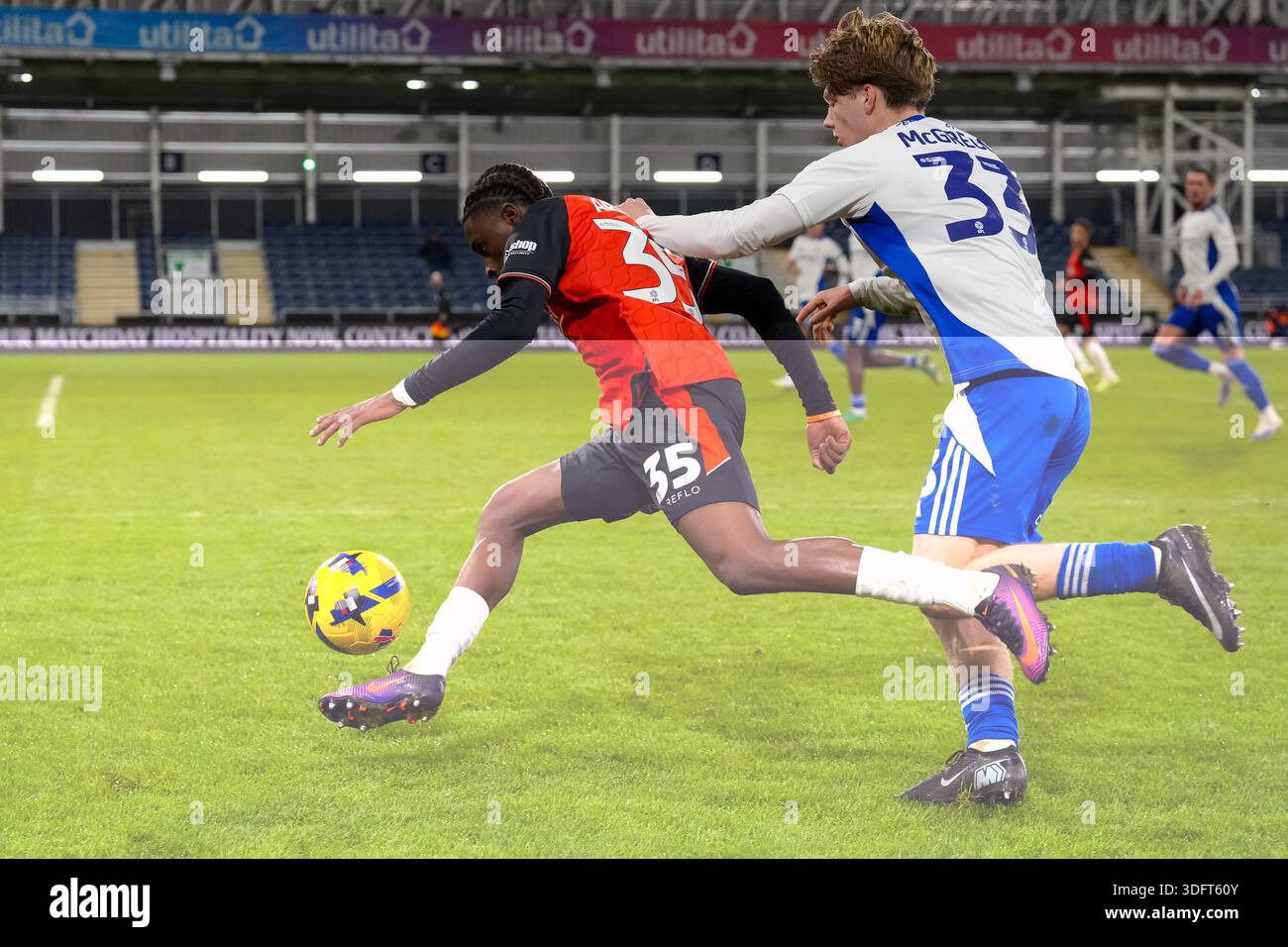 Ethon Archer (35) of Luton Town and Joel McGregor (33) of Swindon Town ...