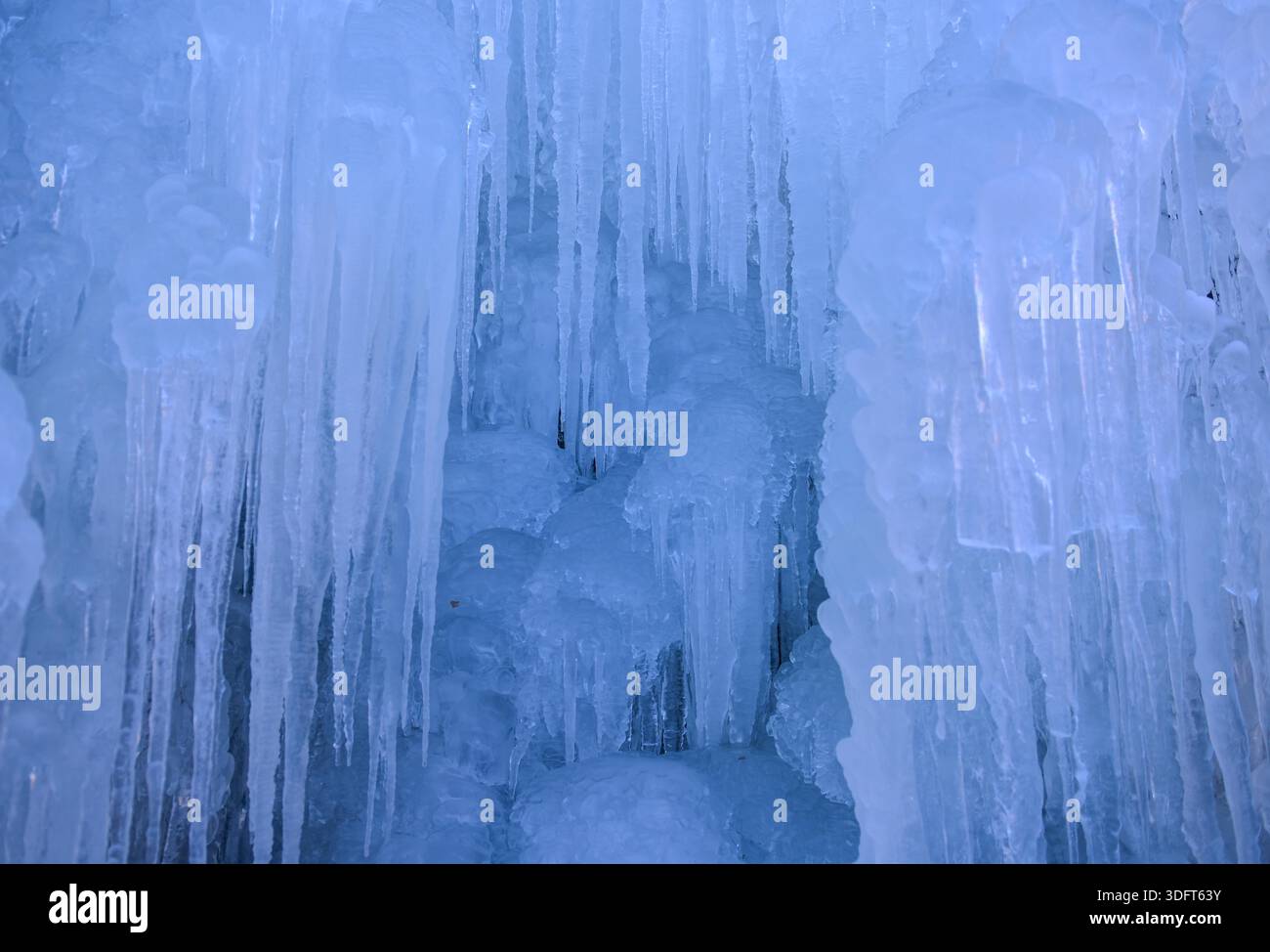 Tourists admire the spectacular ice waterfall scenery of Longtan Grand ...