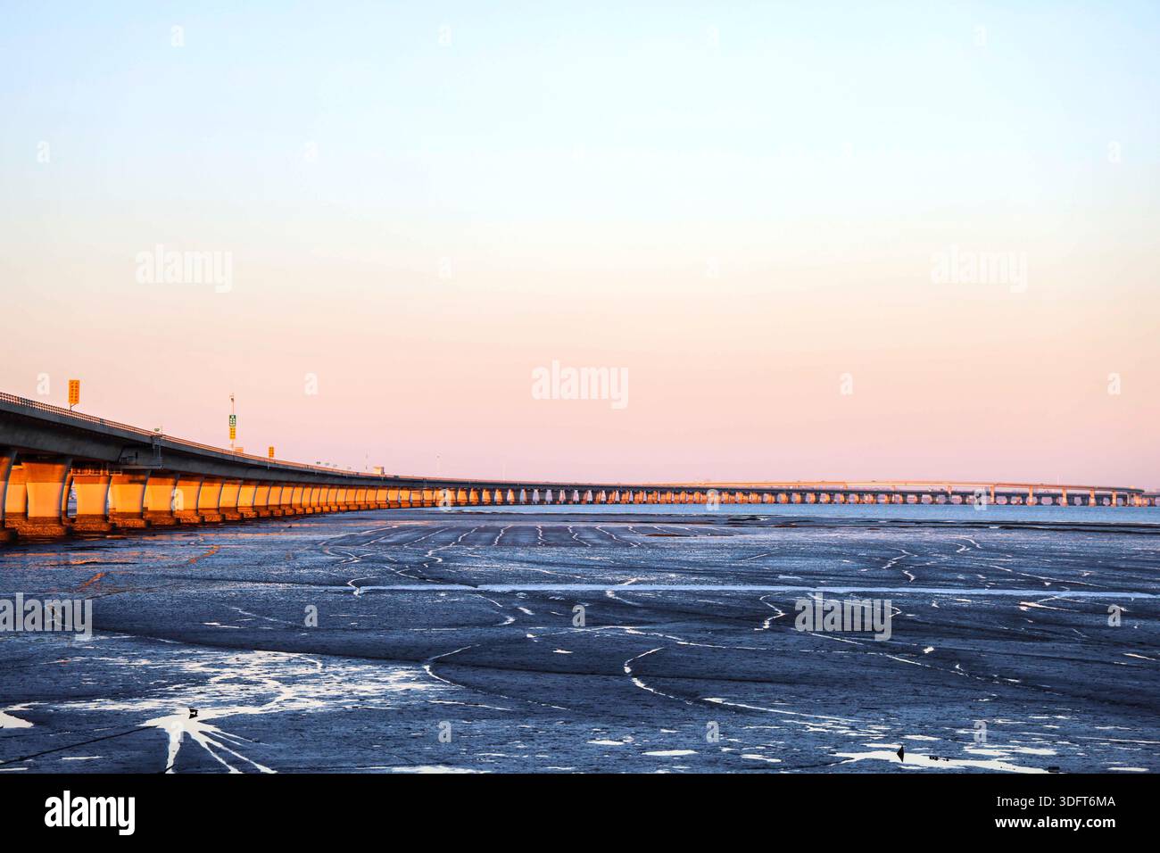 Golden light pierces through Jiaozhou Bay Bridge in West Coast New Area ...