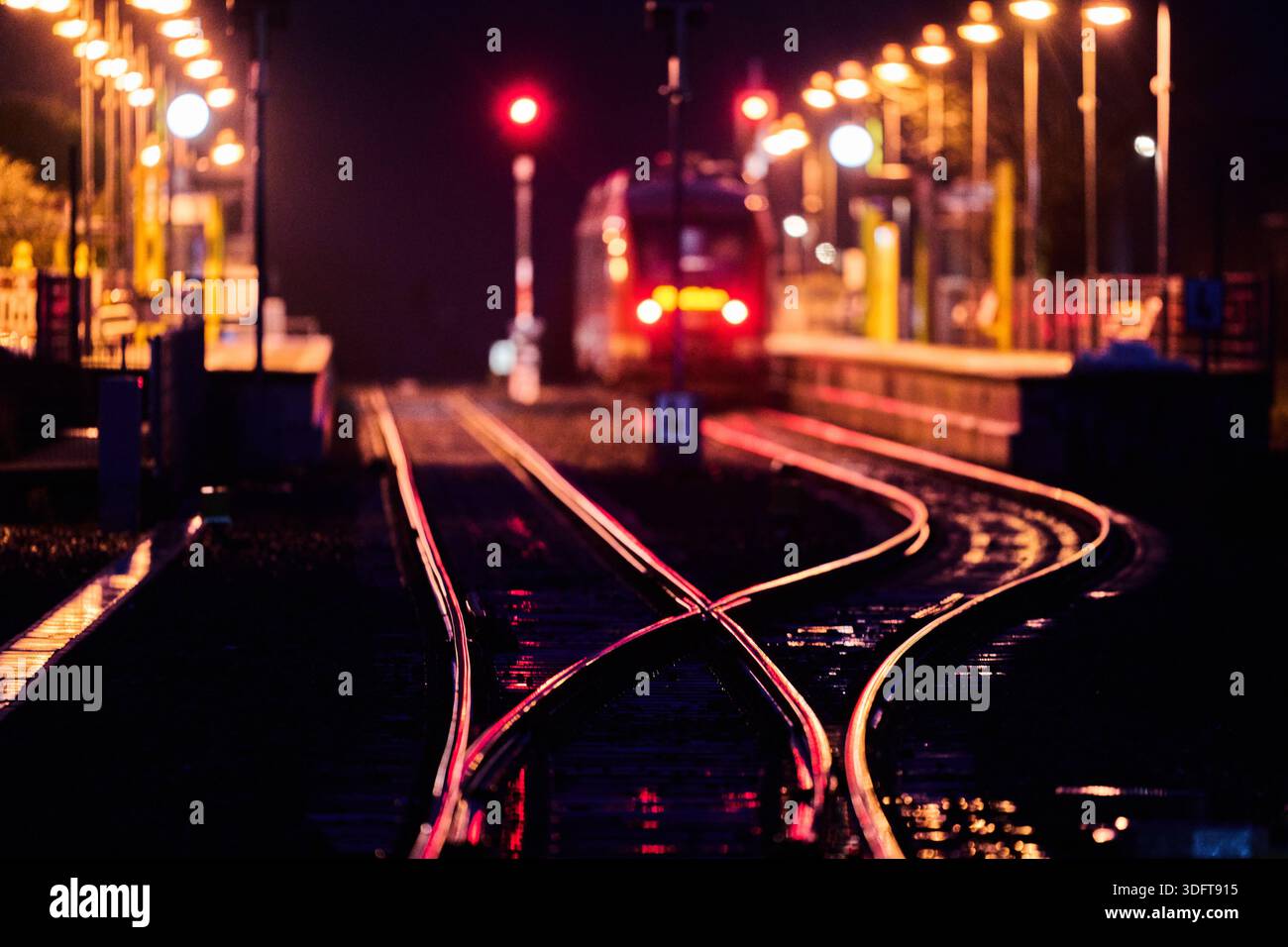 Rails lead to the railway station in Wehrheim near Frankfurt, Germany ...