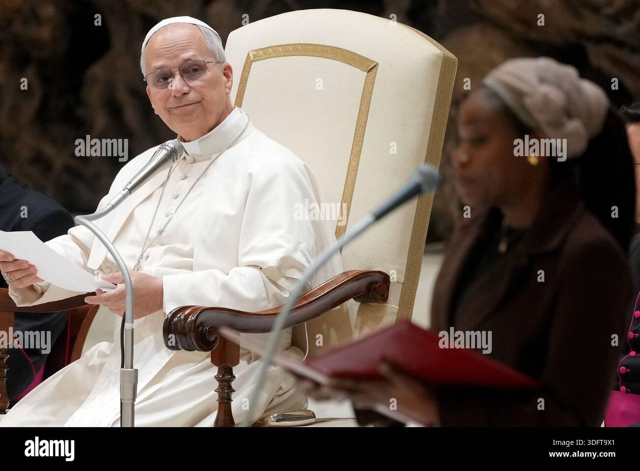Pope Leo XIV listens to speeches during his weekly general audience in ...