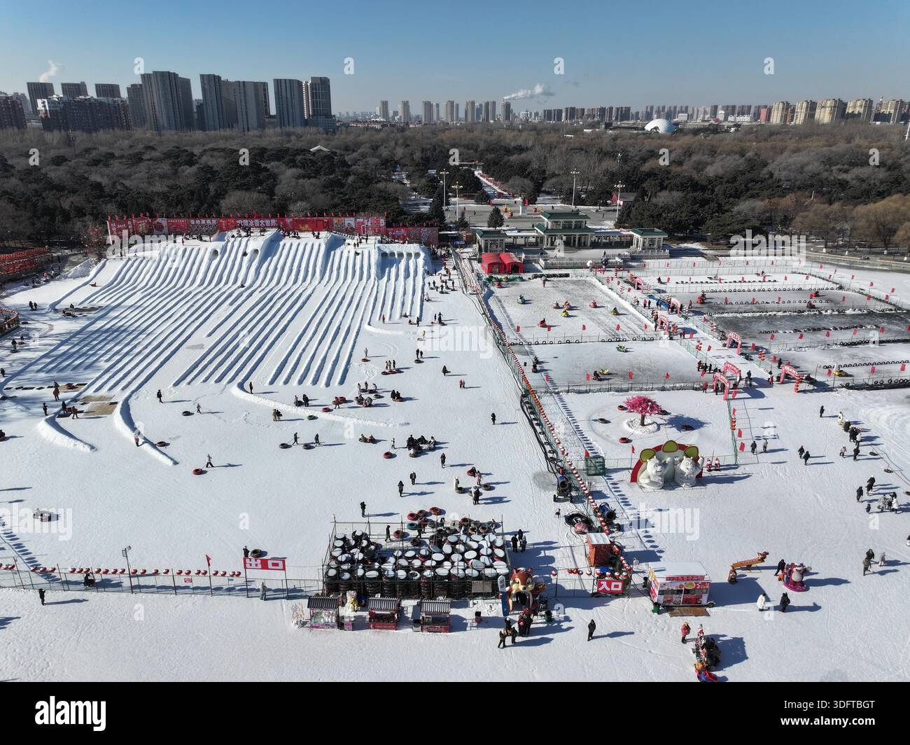 Aerial photo shows visitors enjoying winter sports at Beiling Park in ...