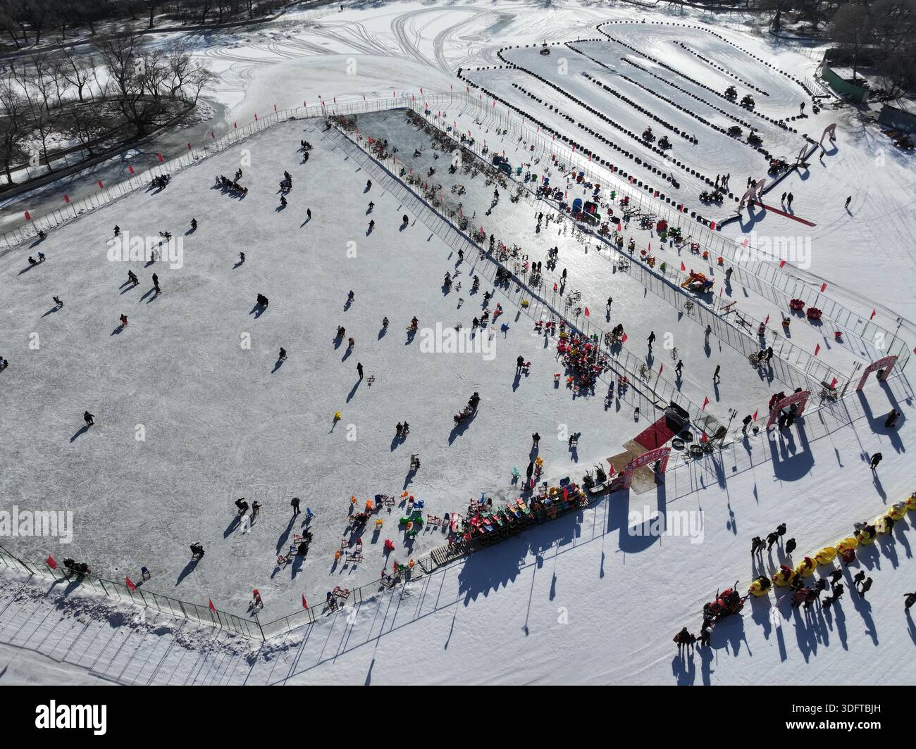 Aerial photo shows visitors enjoying winter sports at Beiling Park in ...