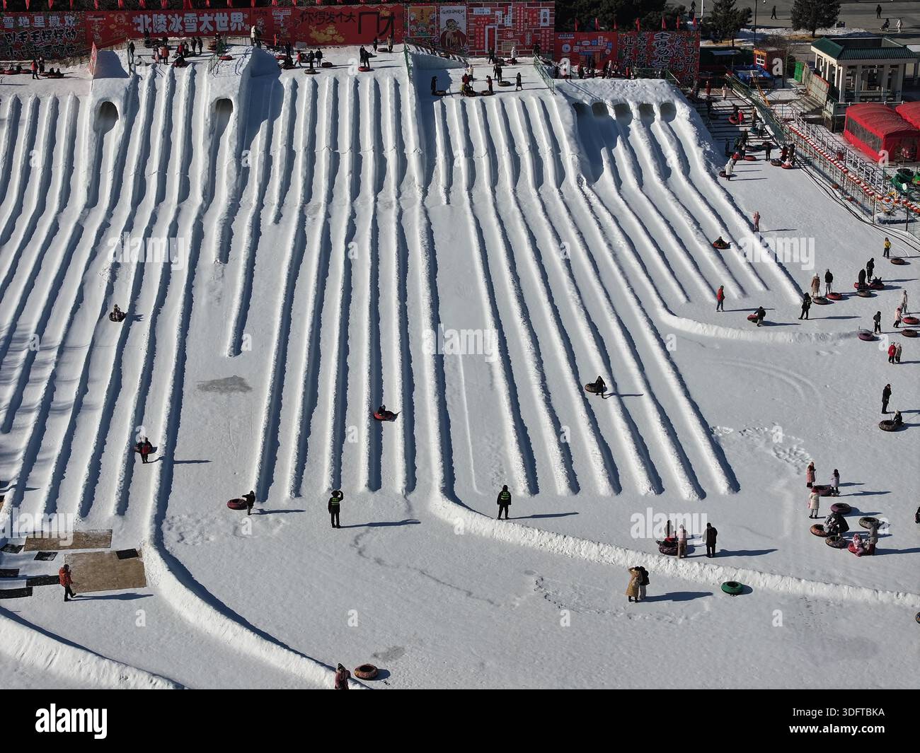 Aerial photo shows visitors enjoying winter sports at Beiling Park in ...
