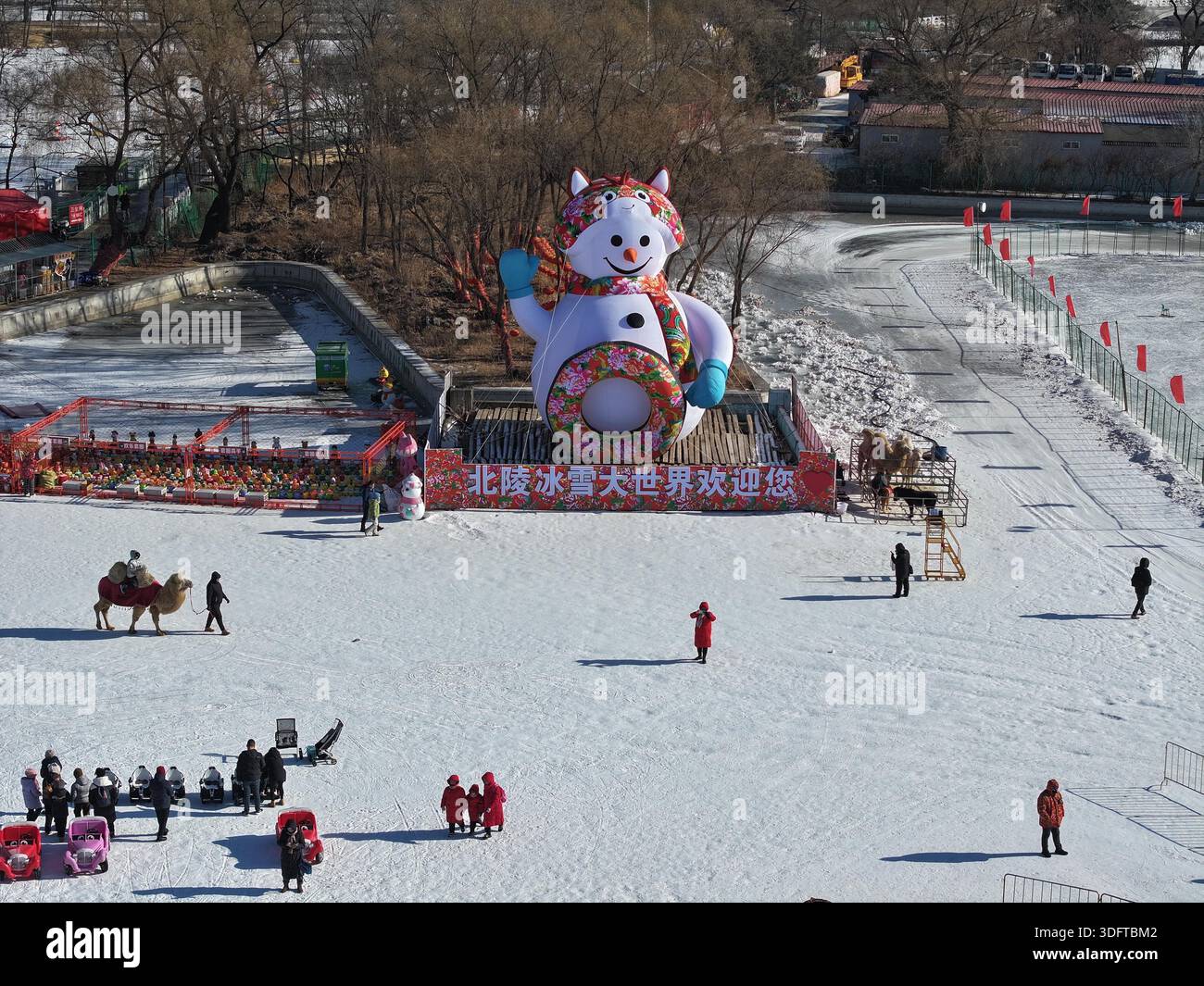 Aerial photo shows visitors enjoying winter sports at Beiling Park in ...
