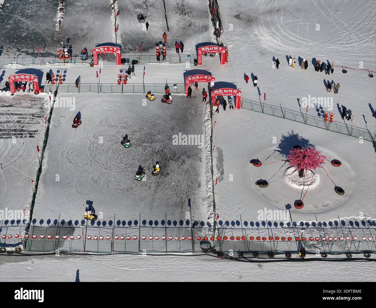 Aerial photo shows visitors enjoying winter sports at Beiling Park in ...