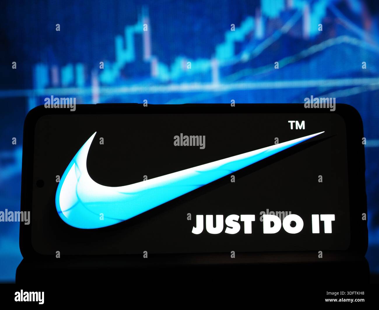 In this photo illustration, Nike, Inc. logo seen displayed on a ...