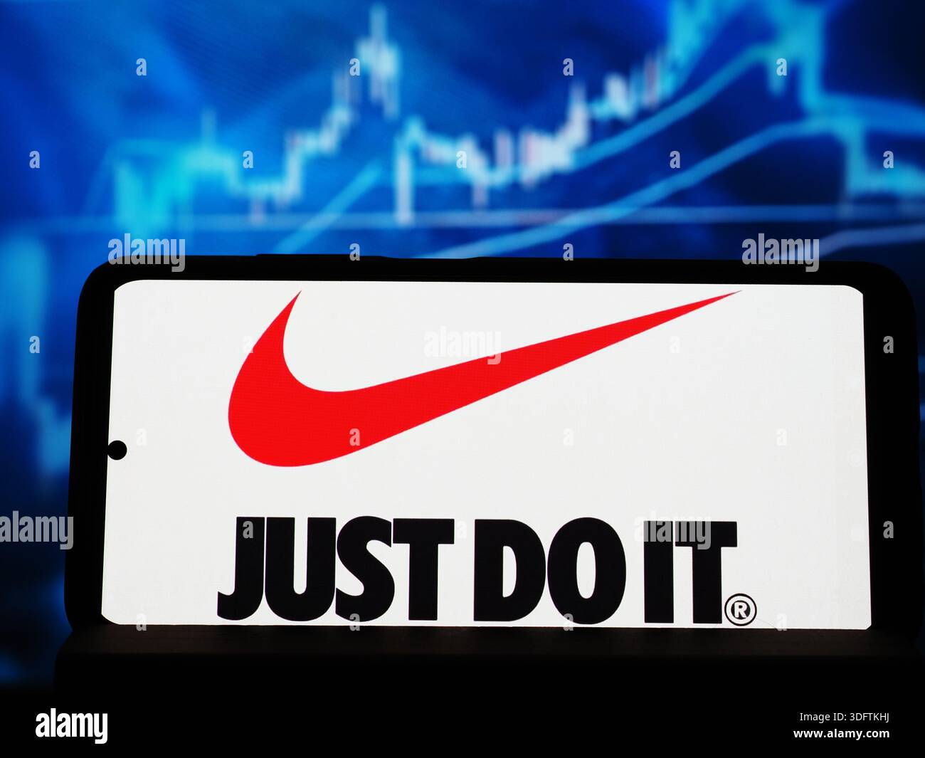 In this photo illustration, Nike, Inc. logo seen displayed on a ...