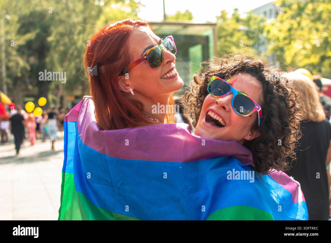 Two women pride parade hi-res stock photography and images - Alamy