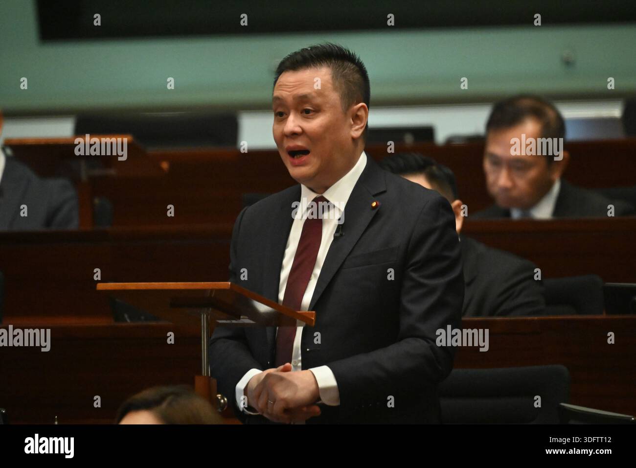 A genial view showing Lawrence Tang Fei speaking at the chambers at the ...
