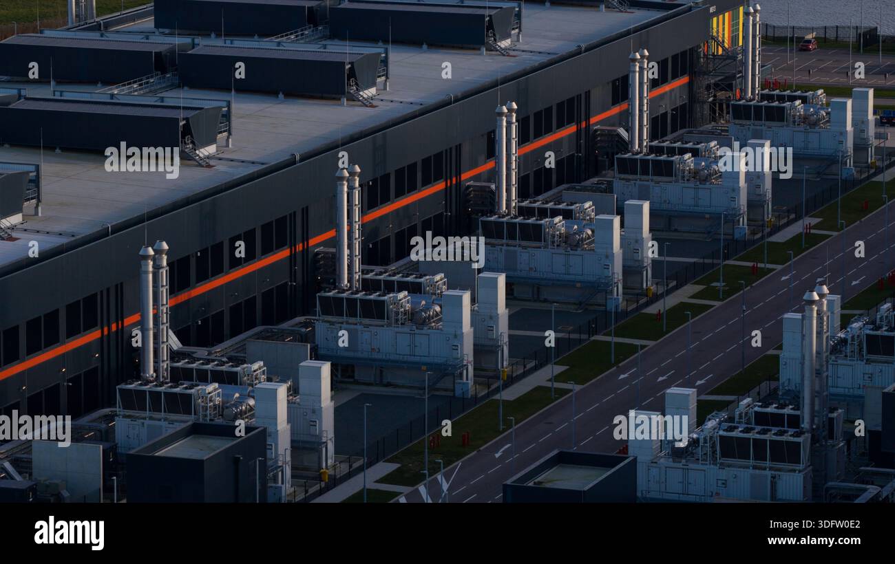 Aerial view of a modern, sprawling industrial complex with dark gray ...