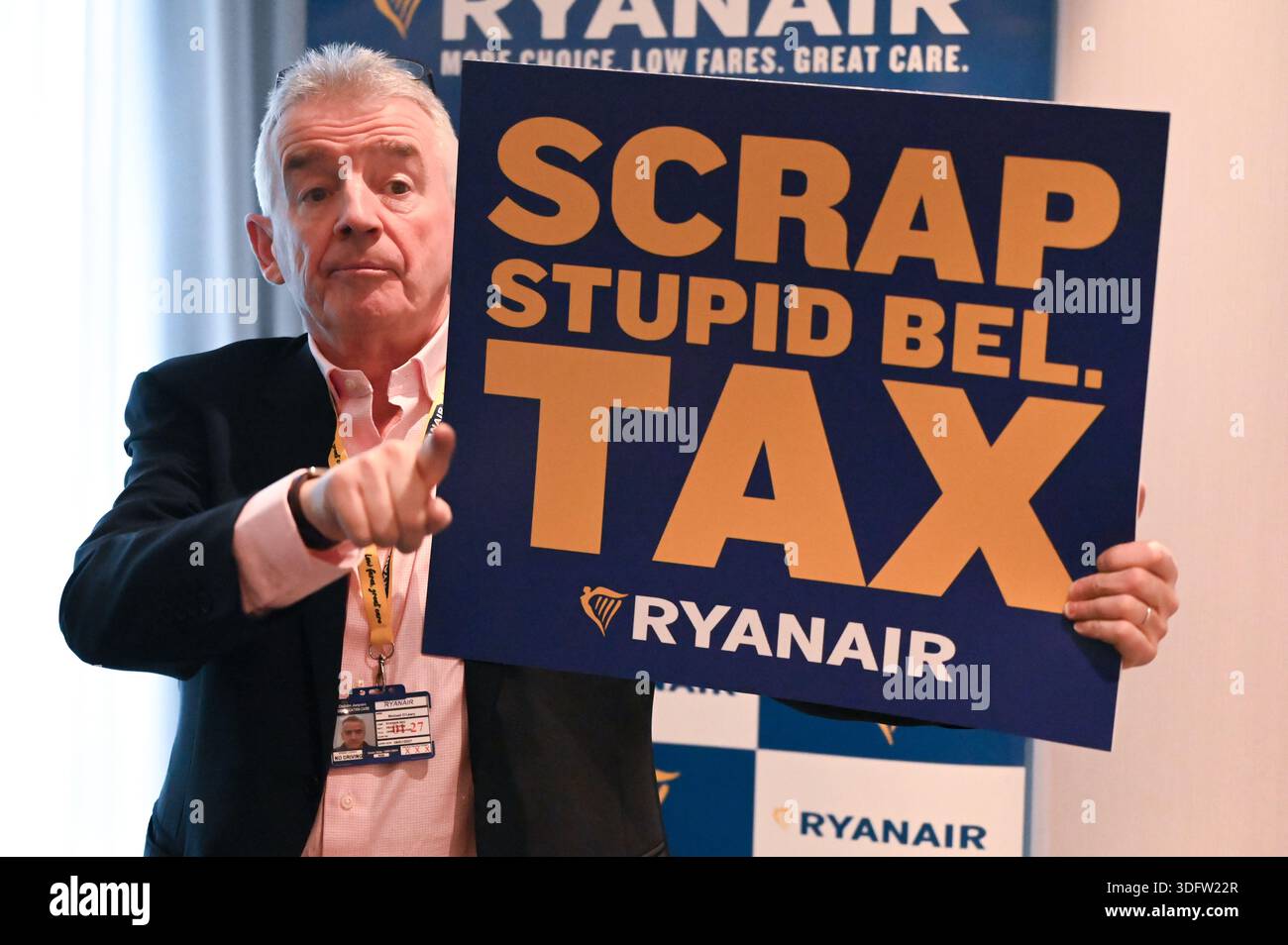 Ryanair CEO Michael O'Leary poses with a slogan at a press conference ...