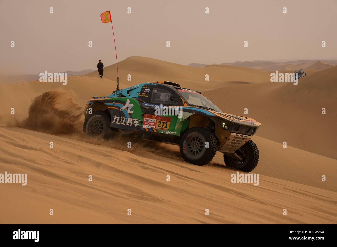 Driver Gaoxiang Fan and co-driver Kai Zhao compete during the tenth ...