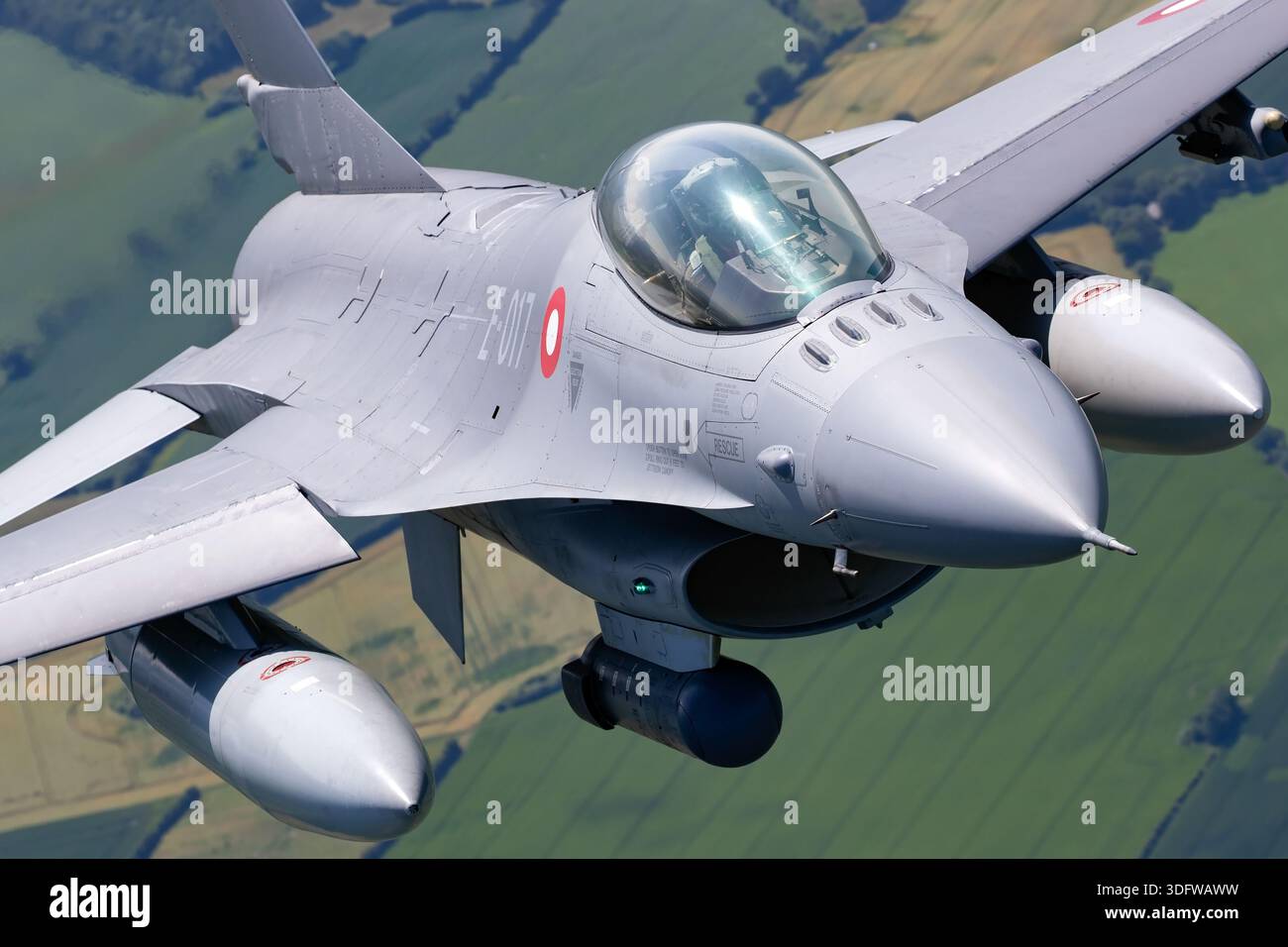 A Royal Danish Air Force F-16AM Fighting Falcon is captured in an air ...