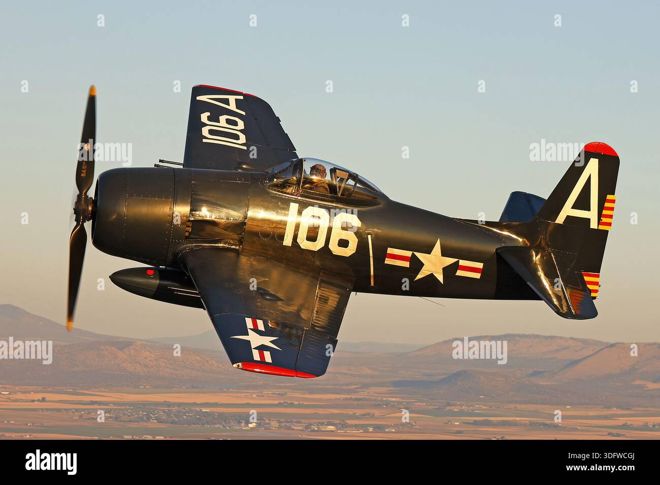 The image shows a Grumman F8F Bearcat warbird in flight, photographed ...