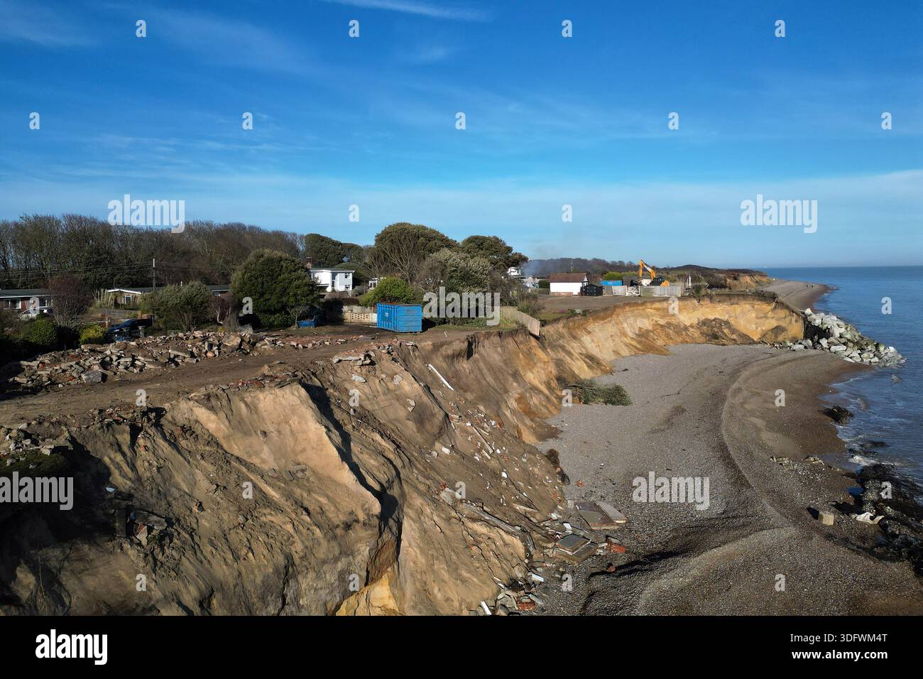 Rubble and debris on the cliff top after homes were demolished ...