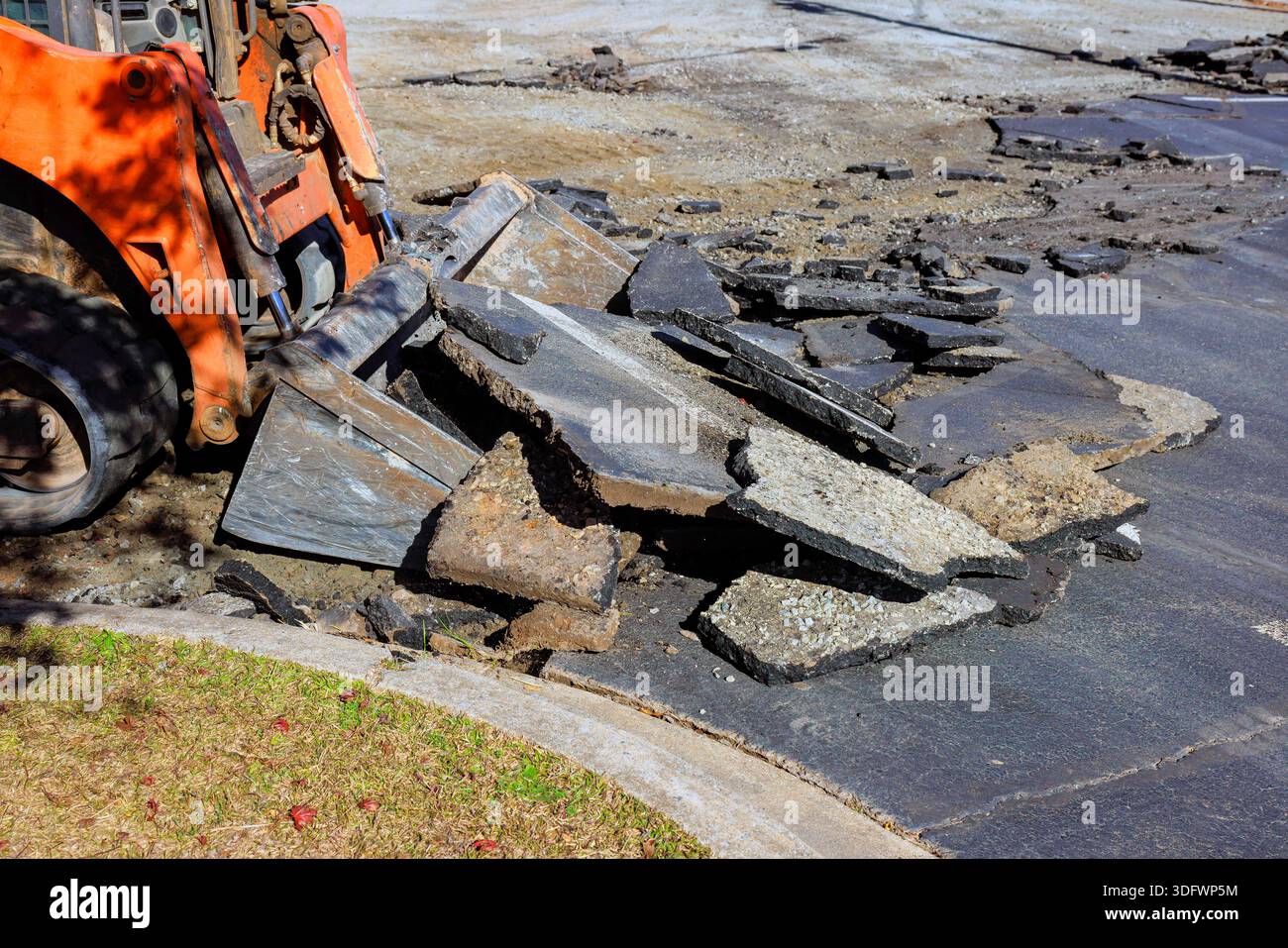 Heavy equipment removing broken pavement hi-res stock photography and ...