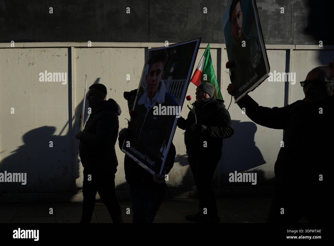 Protesters hold up placards as they demonstrate outside Downing Street ...