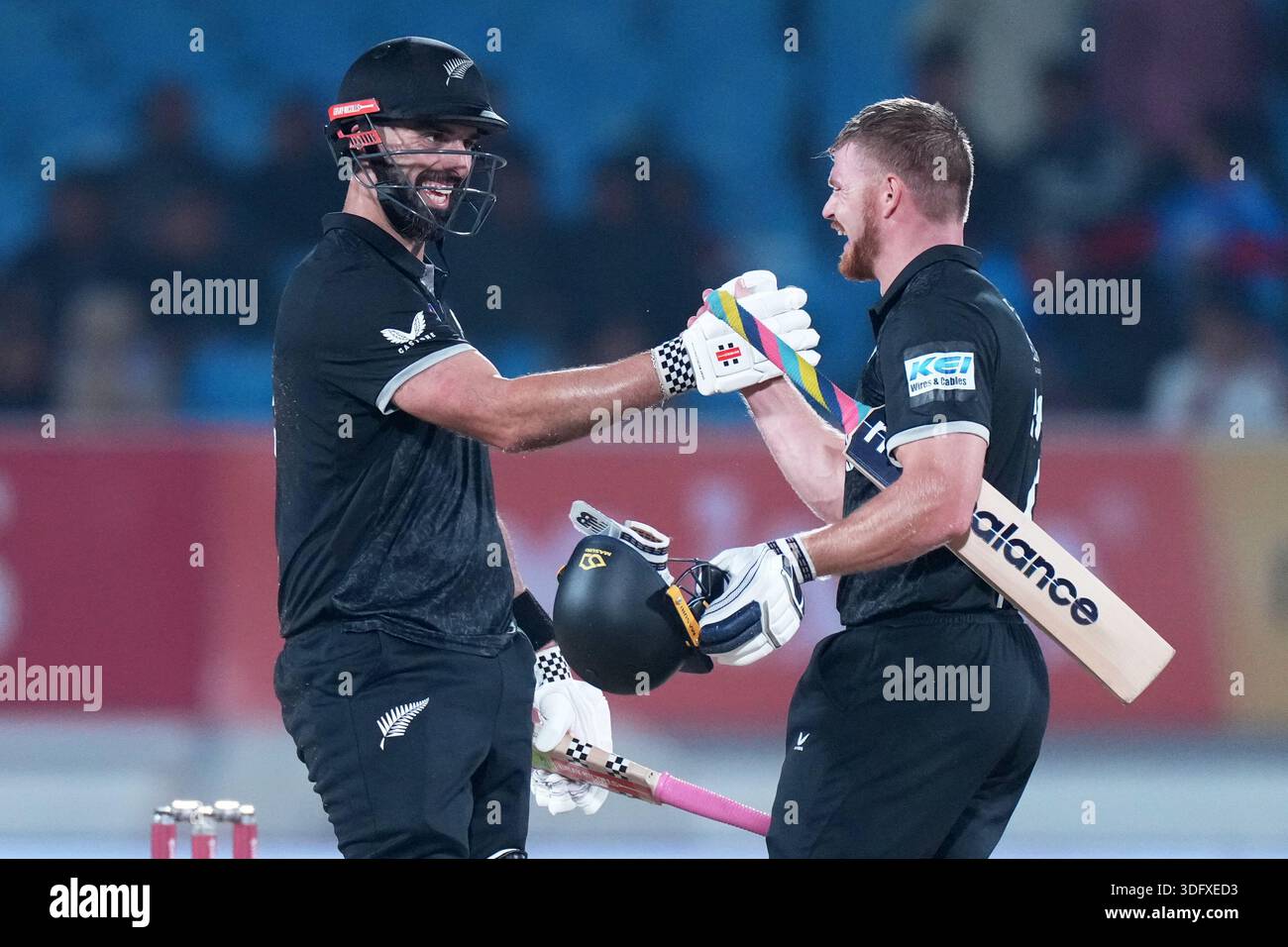 New Zealand's Daryl Mitchell, left, and New Zealand's Glenn Phillips ...