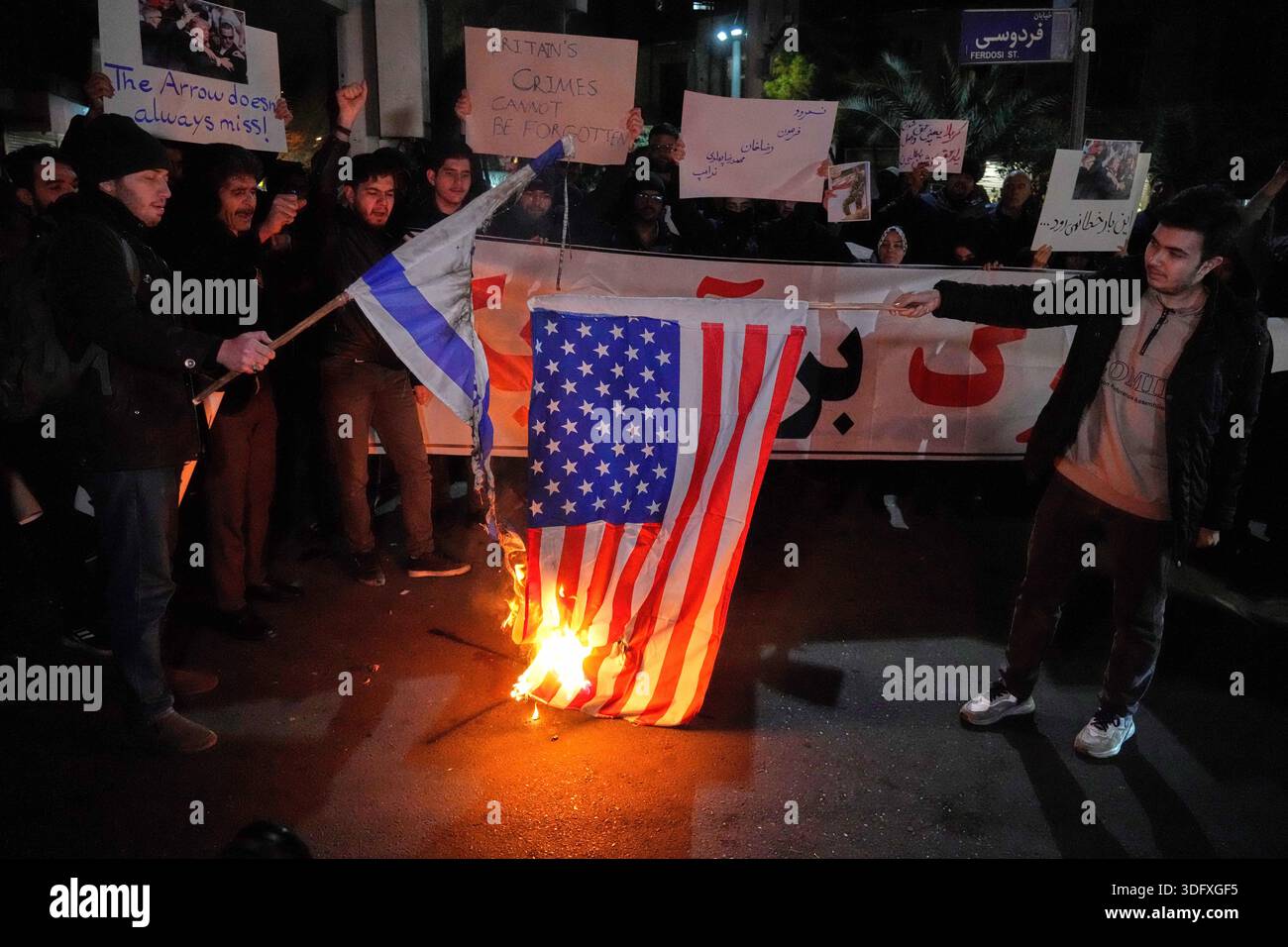 Pro-government protesters burn representations of the U.S. and the ...