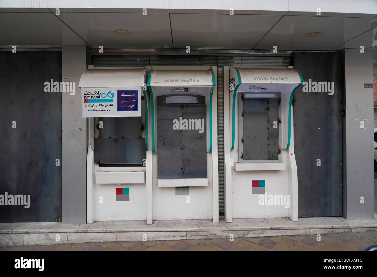A bank's ATMs and windows are covered with metal sheets after anti ...