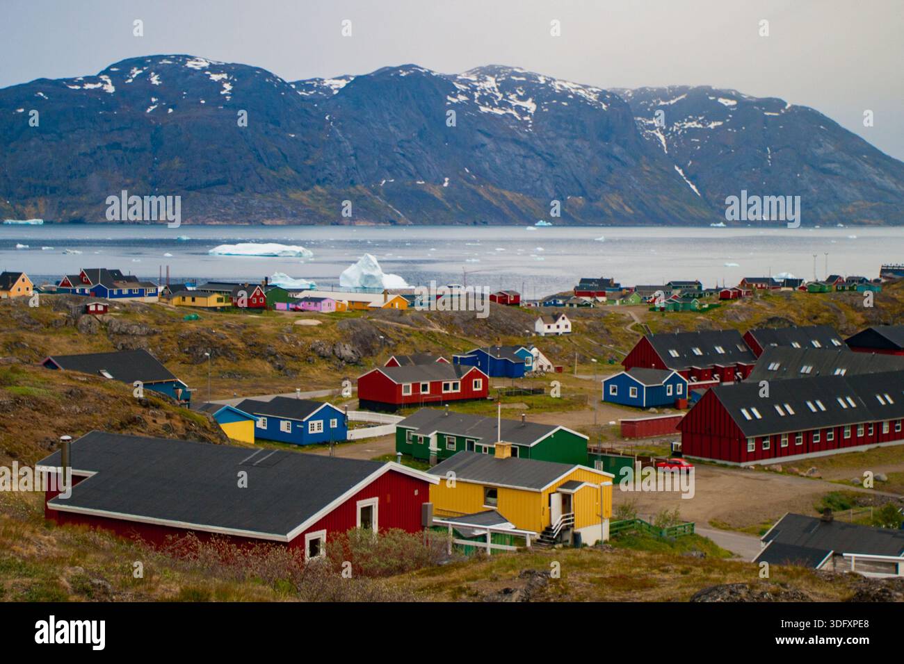 Houses in the village of Narsaq, on June 24, 2009, in Narsaq, Greenland ...