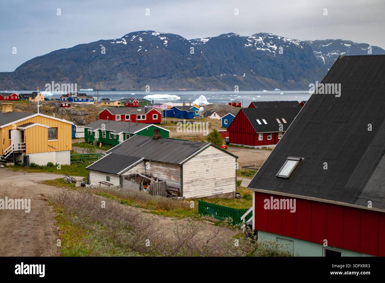 Houses in the village of Narsaq, on June 24, 2009, in Narsaq, Greenland ...