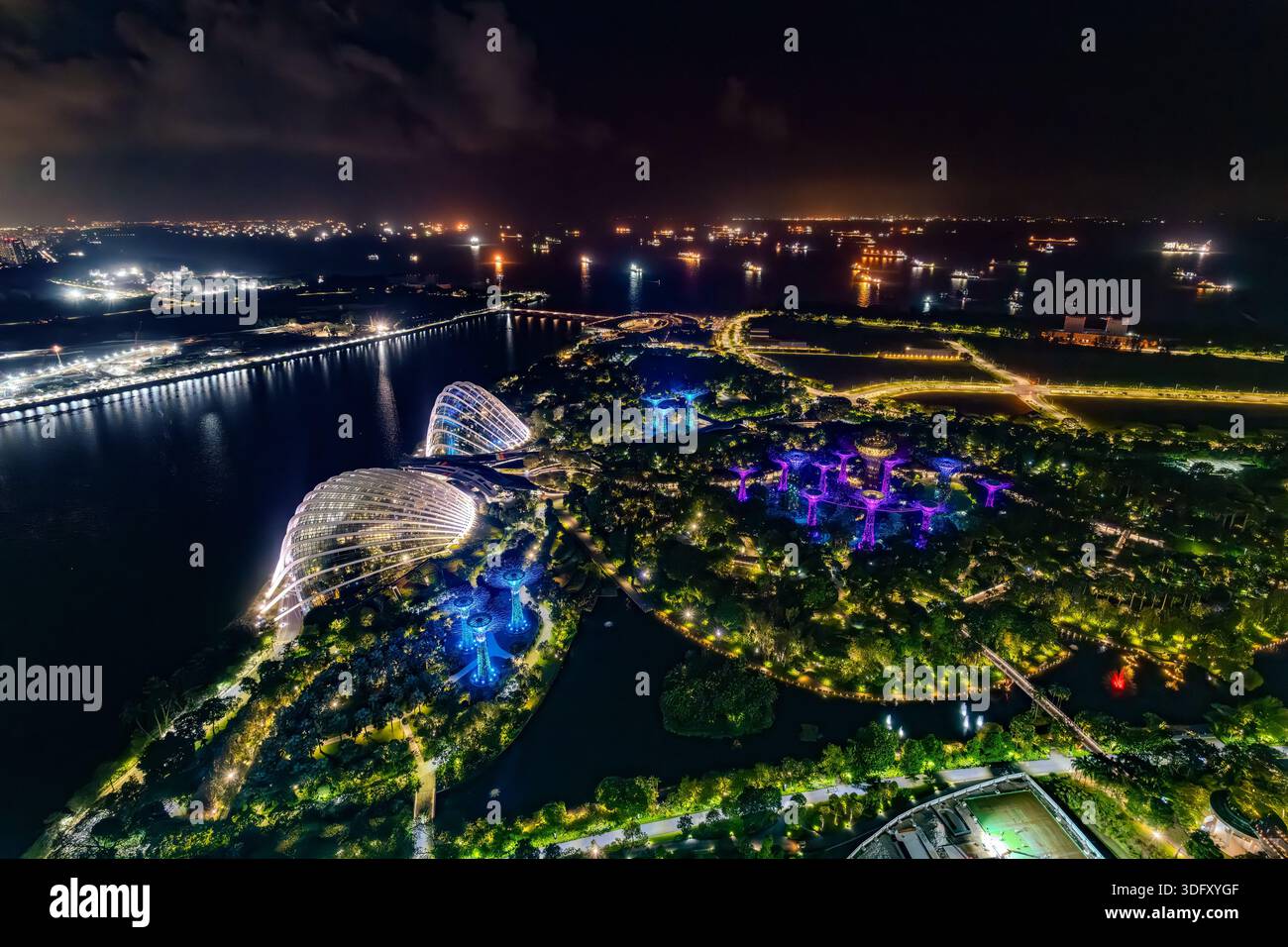 Aerial view over the illuminated Gardens by the Bay / GBTB and ...