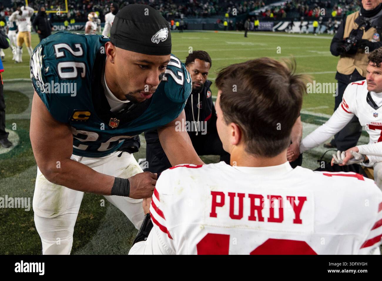 San Francisco 49ers quarterback Brock Purdy, right, talks with ...