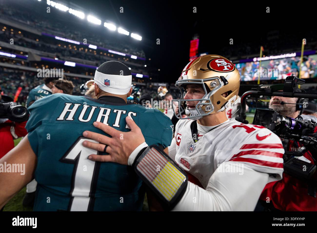 San Francisco 49ers quarterback Brock Purdy, right, talks with ...