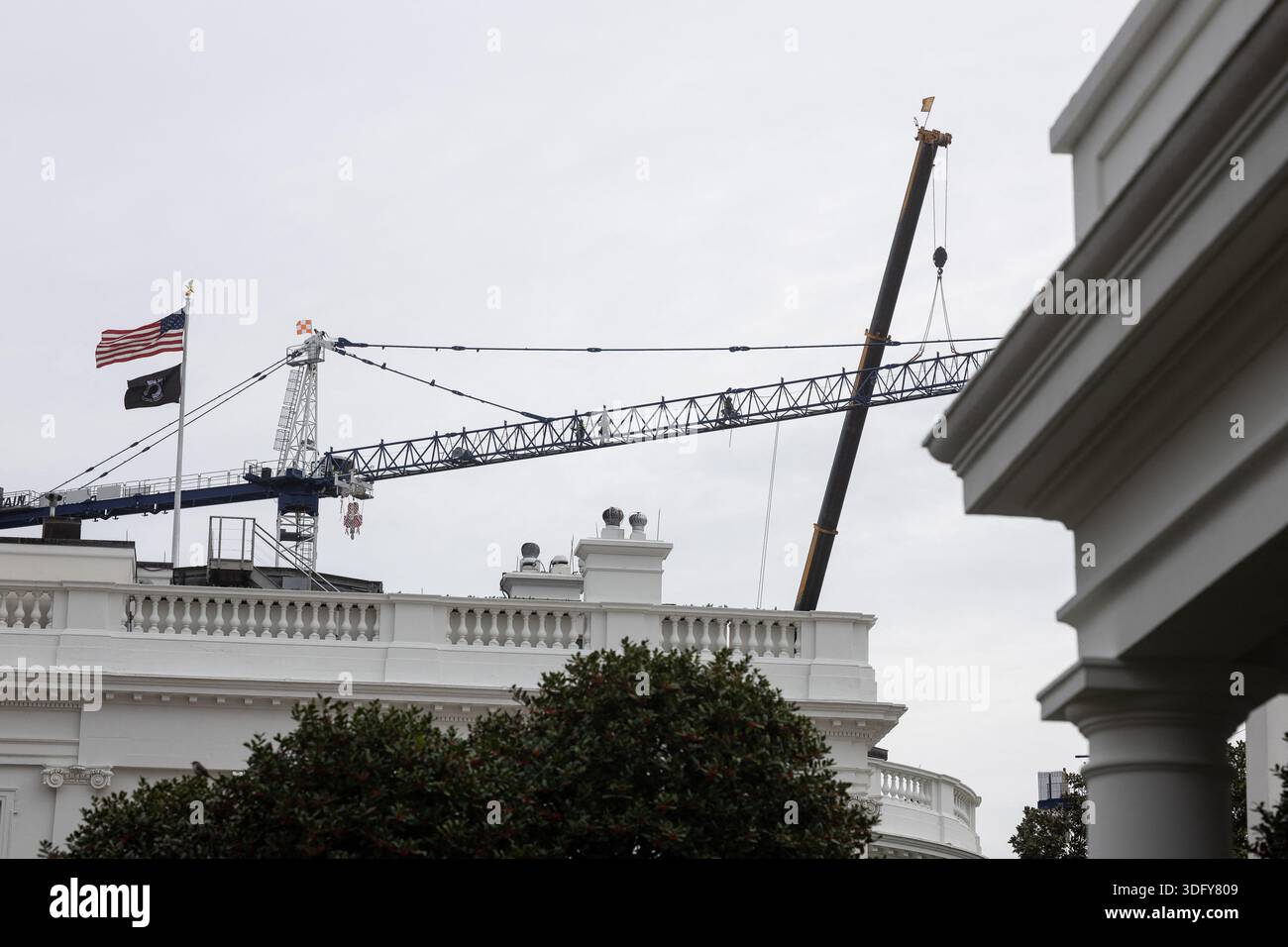A construction crane is seen outside the White House Jan. 14, 2026 ...