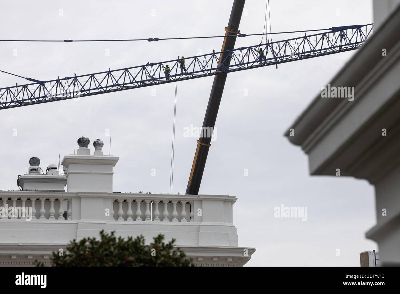 A construction crane is seen outside the White House Jan. 14, 2026 ...