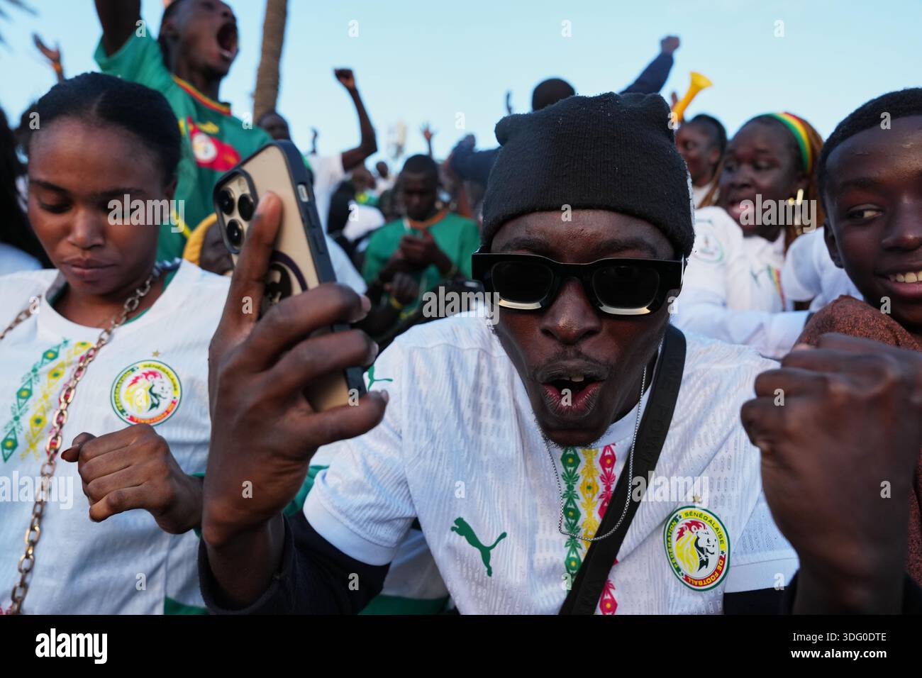 Fans celebrate Senegal's goal as they watch a live broadcast of the ...