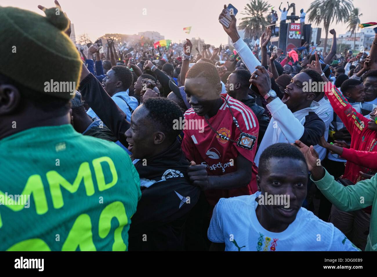 Fans celebrate Senegal's goal as they watch a live broadcast of the ...