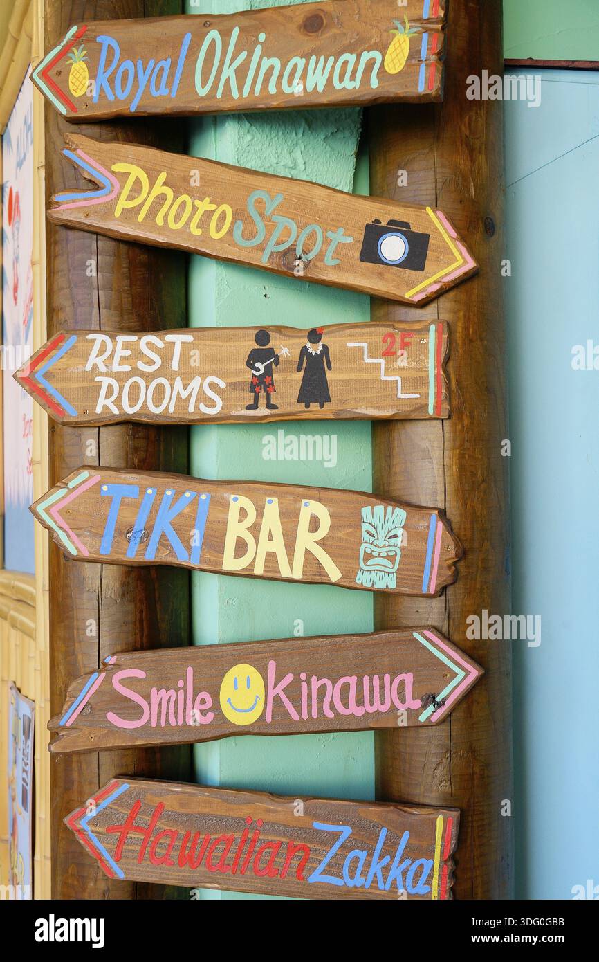 Wooden signs where is inscribed Royal Okinawan, Rest Rooms, Tiki Bar ...