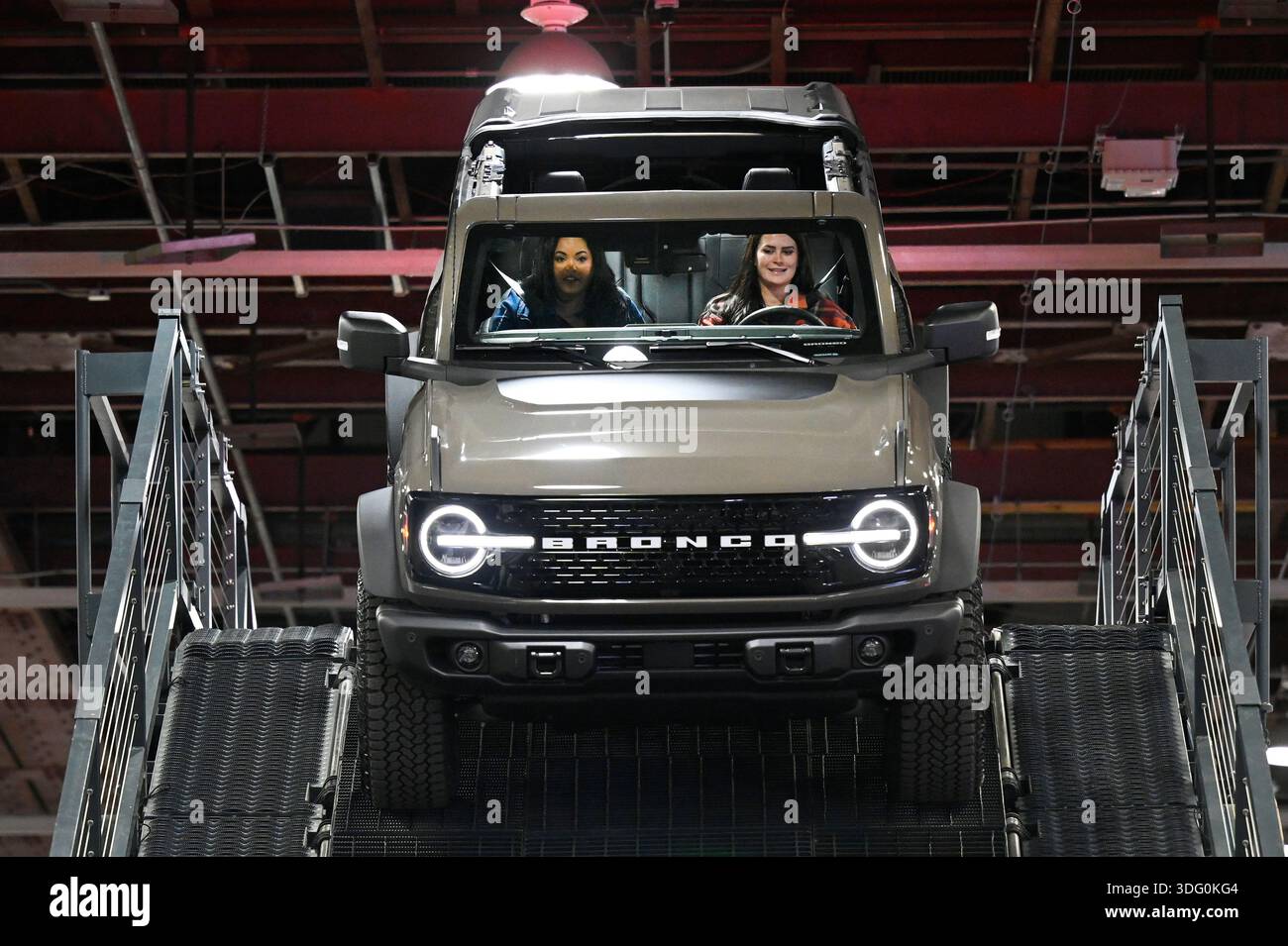 A guest is driven in a Ford Bronco on a test drive course by a Ford ...